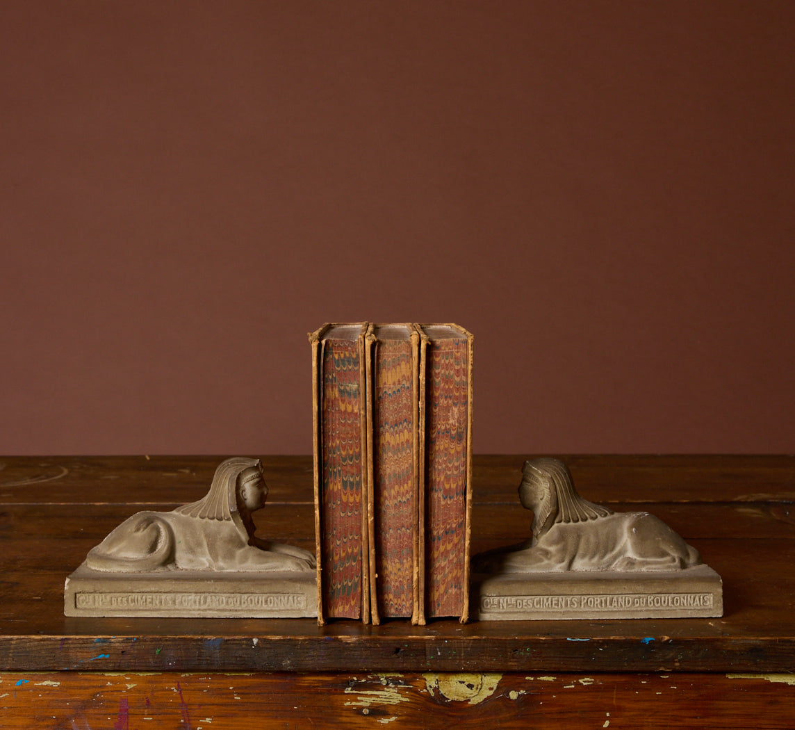PAIR OF CAST STONE SPHINX BOOKENDS – Pierce & Ward